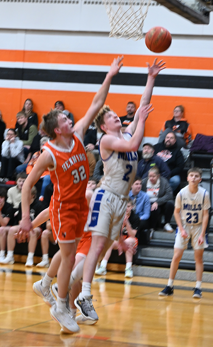 Cole-Wilson-takes-a-contested-shot-during-Tuesdays-game-in-Henning.jpg